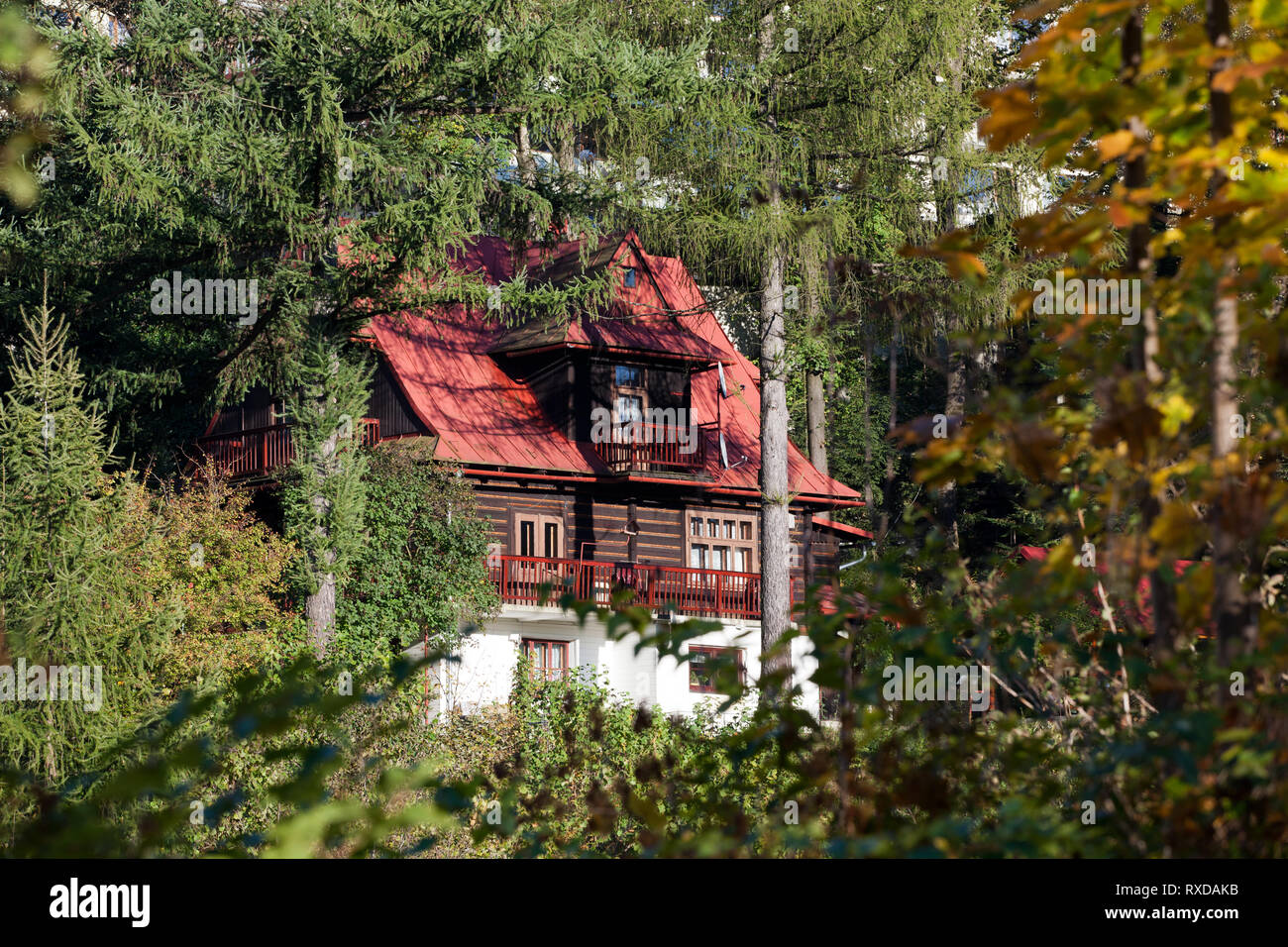 Mountain cottage in the colors of autumn Stock Photo - Alamy