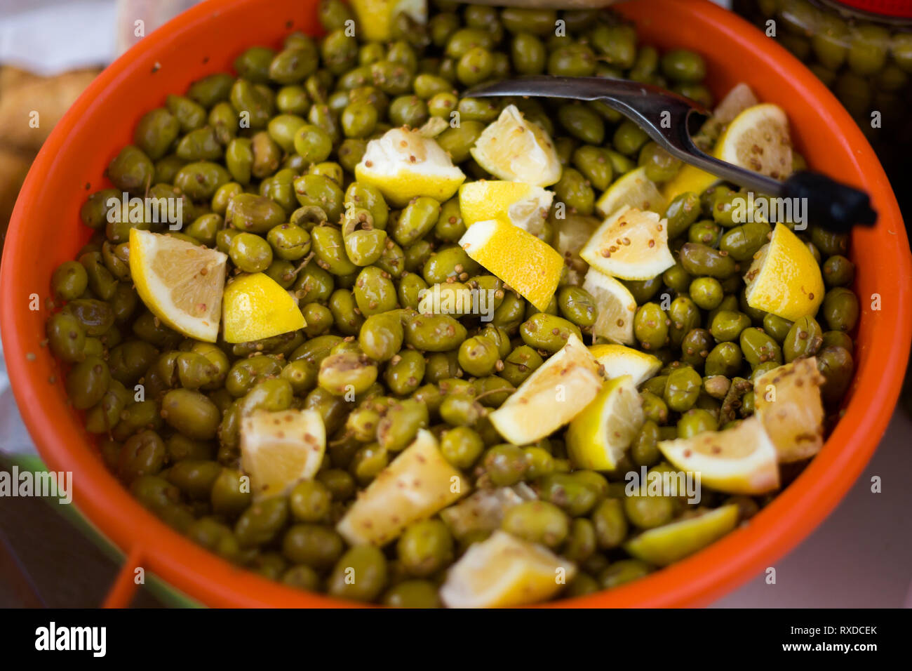 Fresh olives with lemon on local market in capital city Nicosia. Food ...