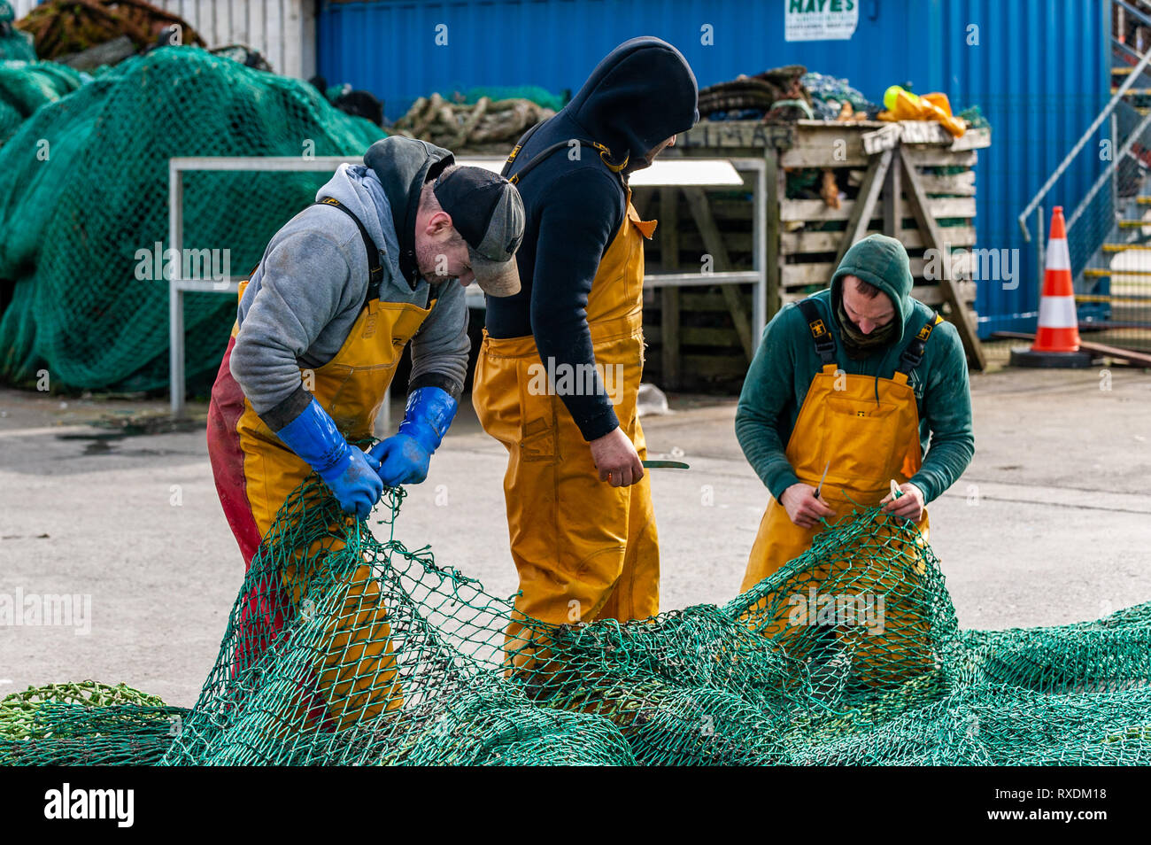 Union Hall, West Cork, Ireland. 9th March, 2019. Fishermen mend broken ...