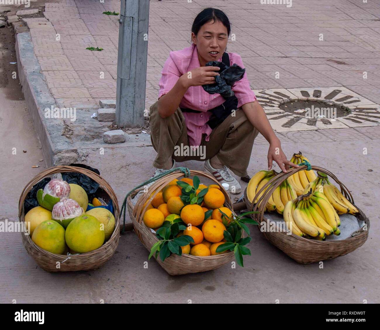 Woman street peddler hi-res stock photography and images - Alamy