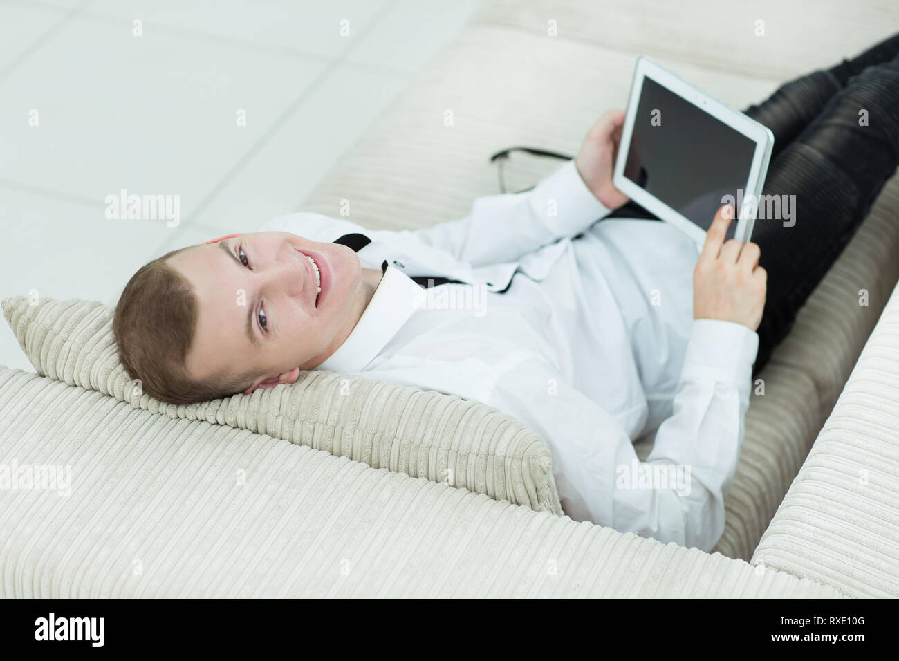 rear view.young man looking at digital tablet screen Stock Photo - Alamy