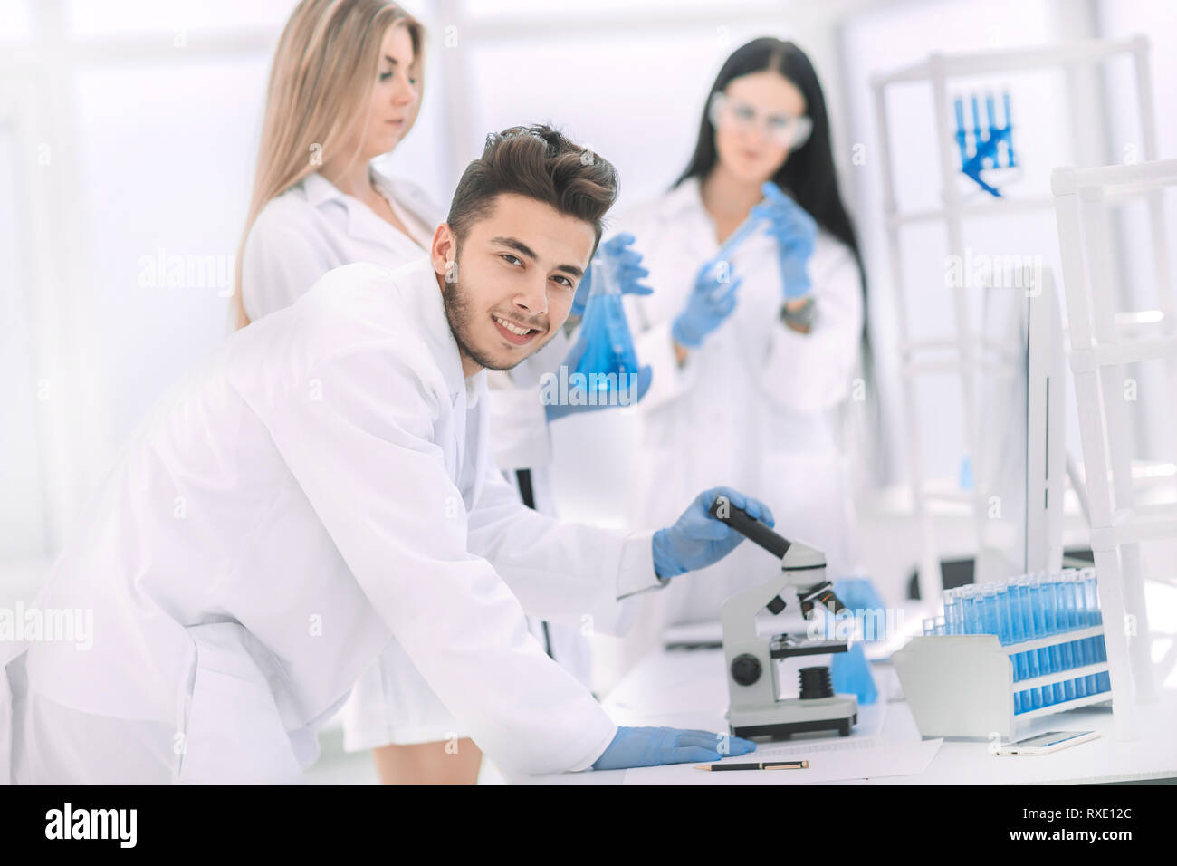 group of young scientist experimenting in the laboratory Stock Photo ...
