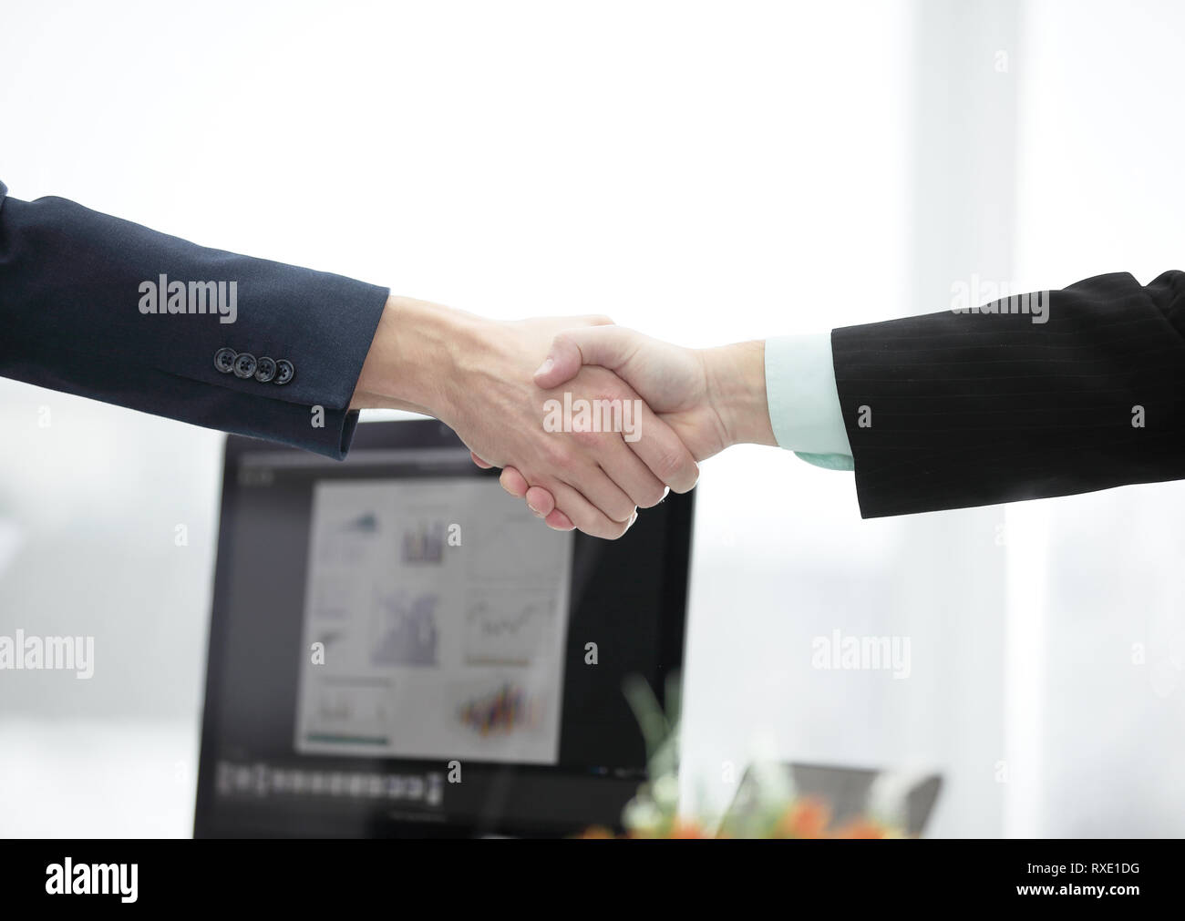 close up.handshake of financial partners on desktop background Stock ...