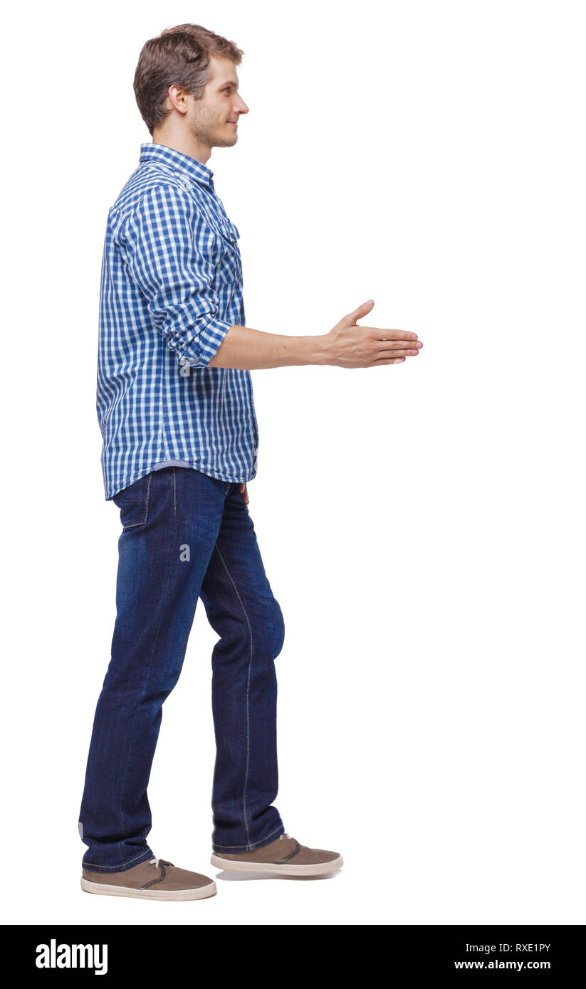 Side view of a walking businessman who stretches his hand for a ...