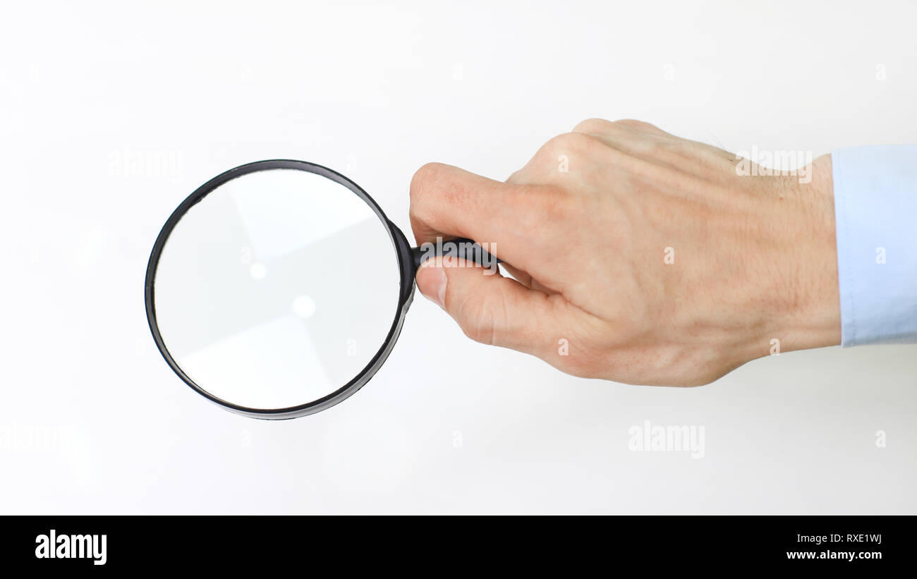 Hand holding magnifier hi-res stock photography and images - Alamy