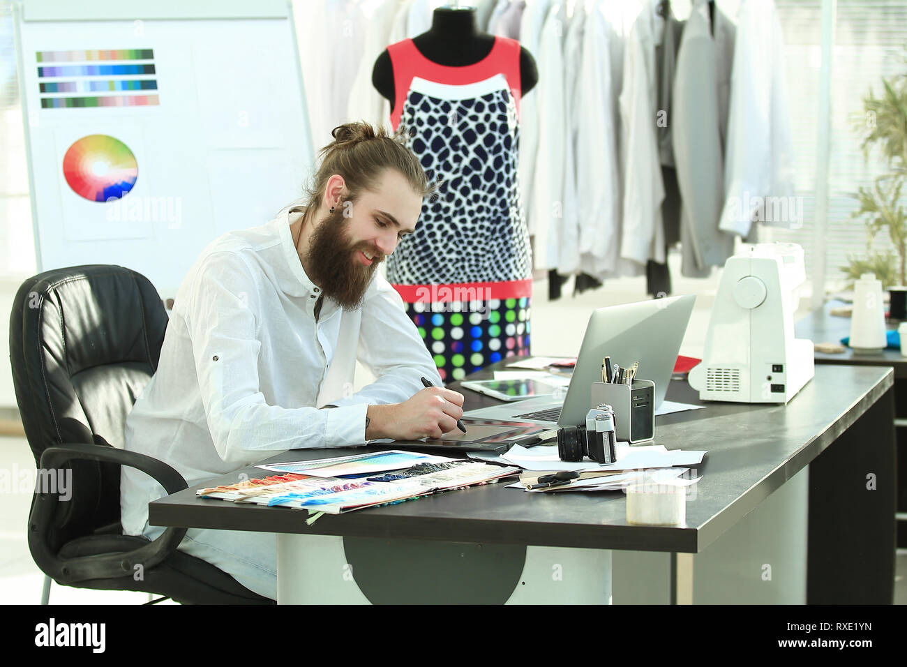 successful designer working on new sketches of clothes Stock Photo - Alamy