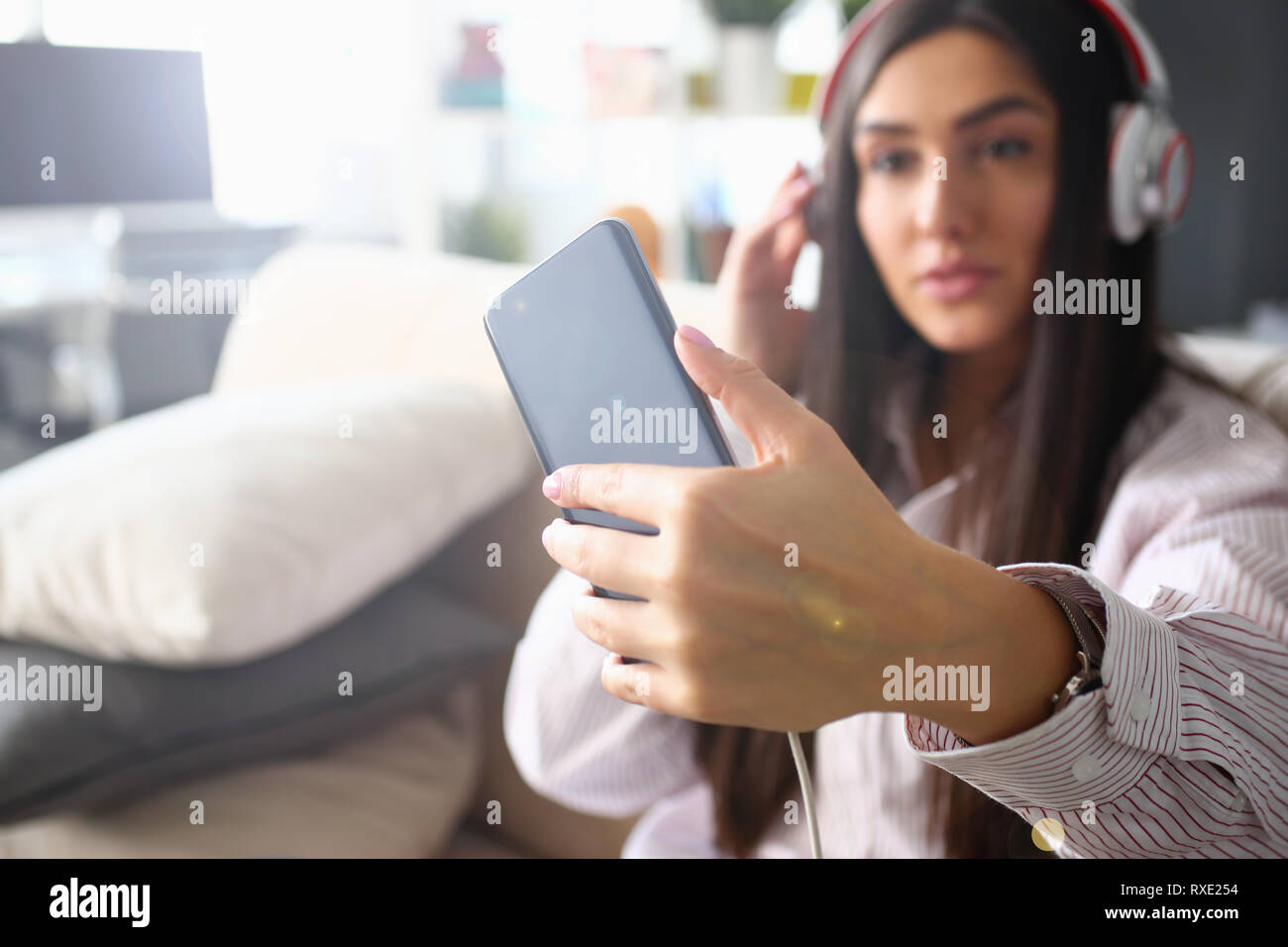 Young beautiful woman look camera holds Stock Photo - Alamy
