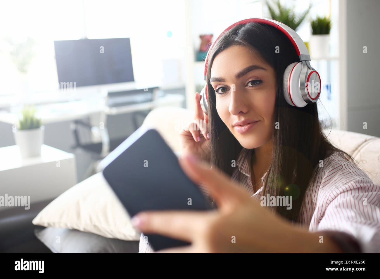Young beautiful woman look camera holds Stock Photo - Alamy