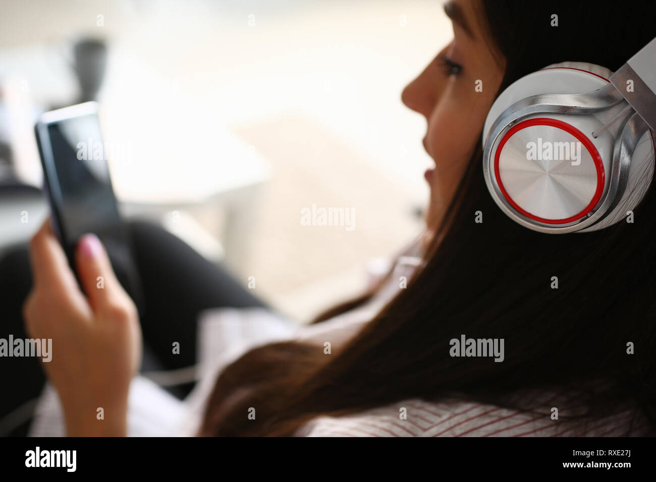 Young beautiful woman look camera holds Stock Photo - Alamy