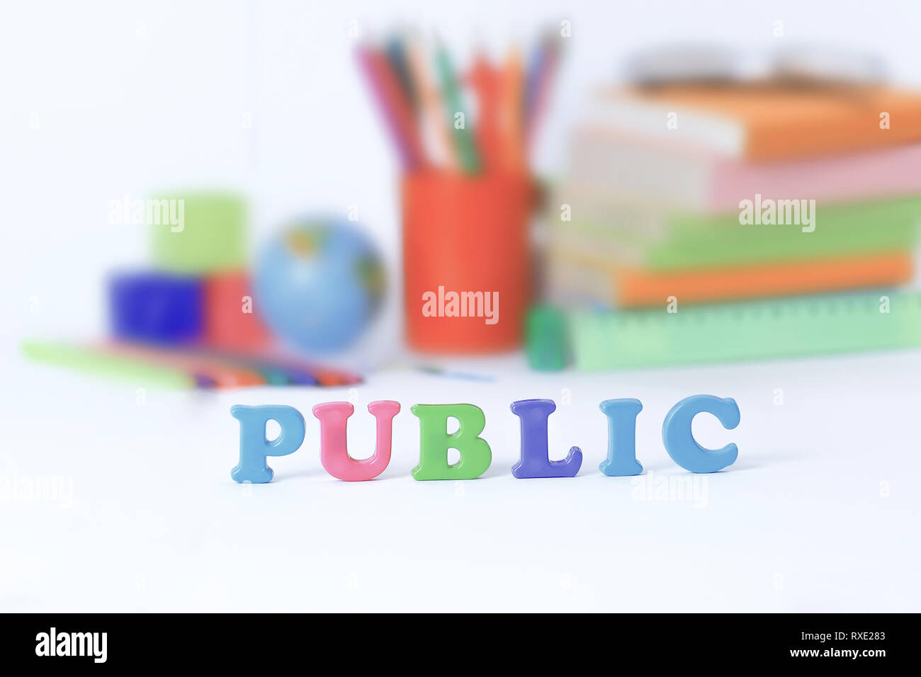 word public on blurred background of school supplies .photo with copy ...