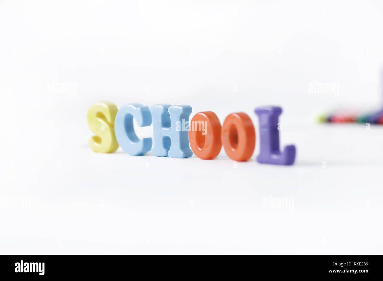 word school on blurred background of school supplies .photo with copy ...