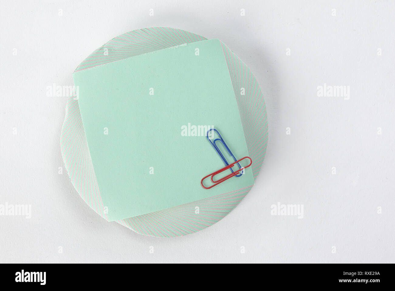 blank sheet for notes and paper clip isolated on white background Stock ...