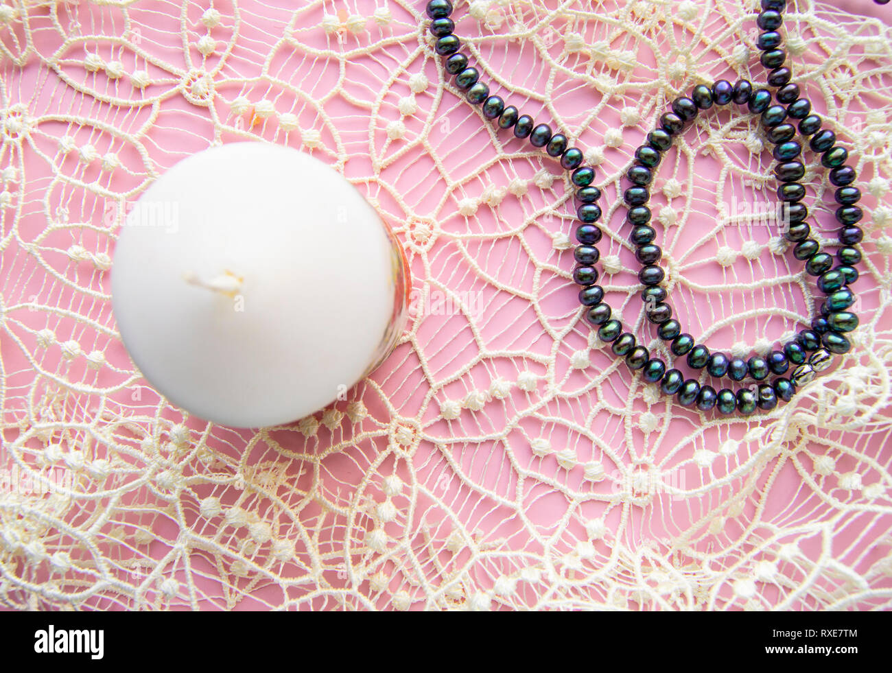 Flatlay pink background, graceful white expensive lace and elegant ...
