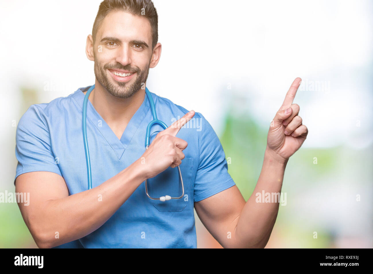Handsome young doctor surgeon man over isolated background smiling and ...