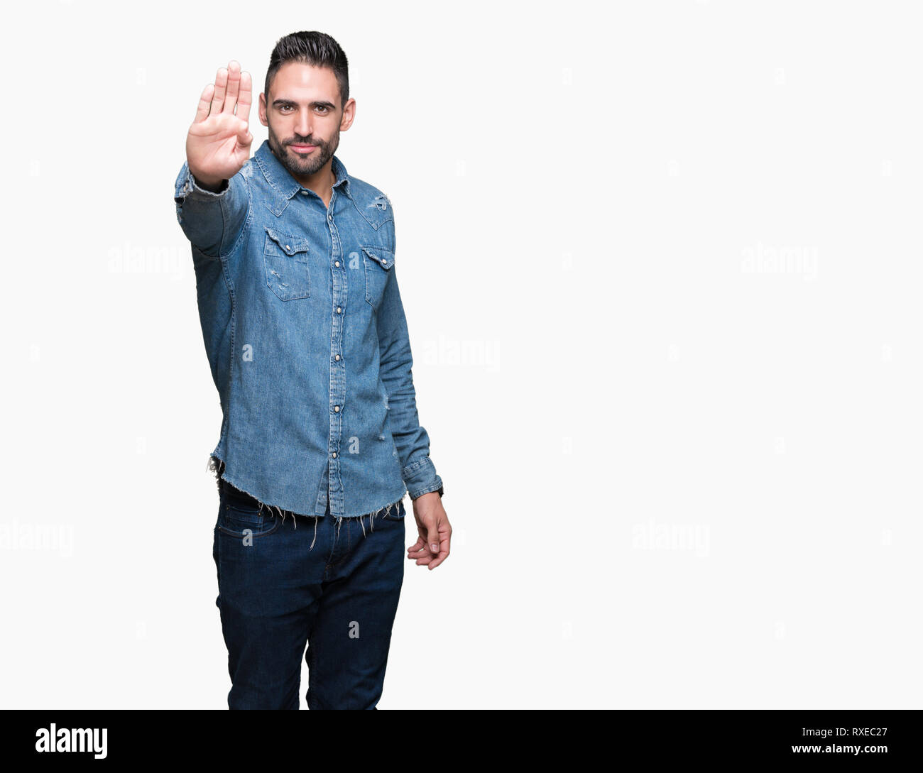 Young handsome man over isolated background doing stop sing with palm ...