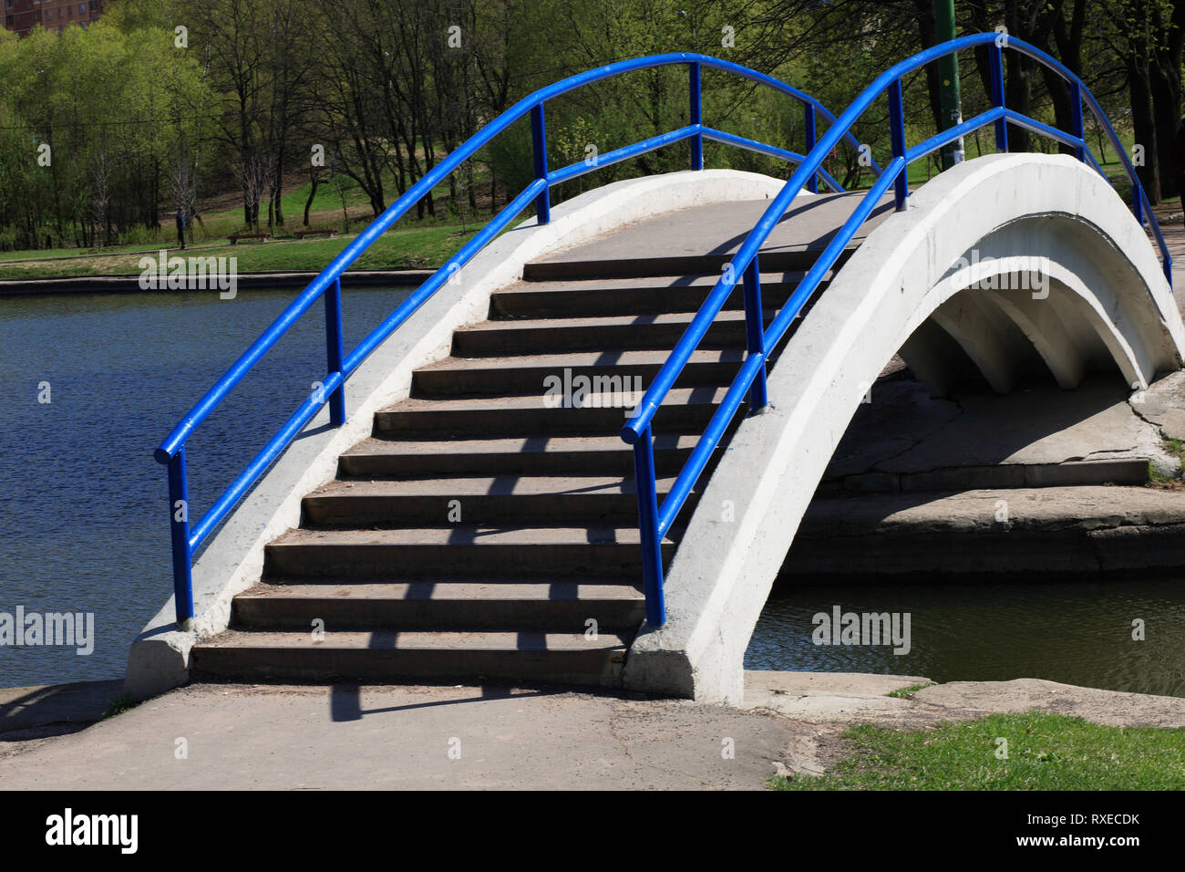 bridge over pond with handhold Stock Photo - Alamy