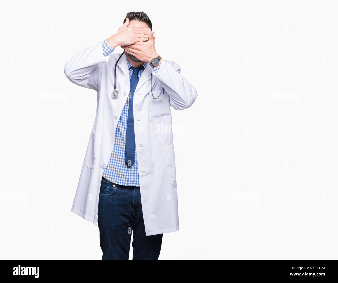 Handsome young doctor man over isolated background Covering eyes and ...
