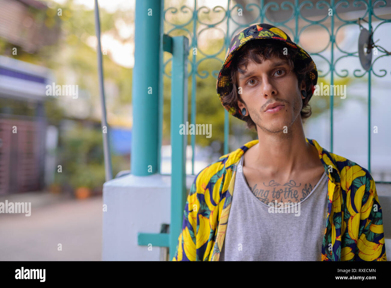 Face of young rebellious man at home outdoors Stock Photo - Alamy