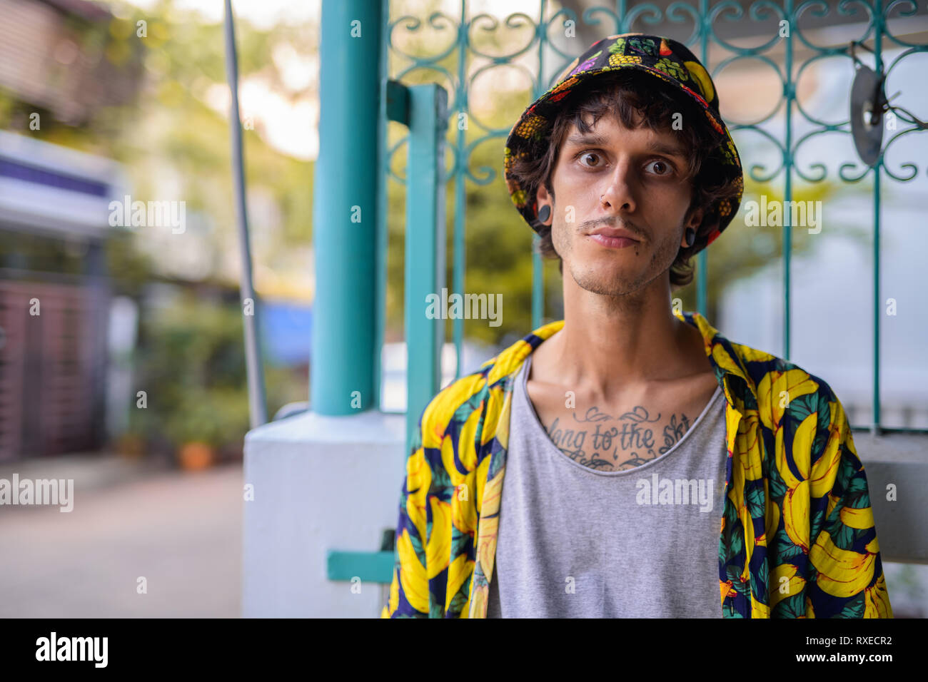 Face of young rebellious man at home outdoors Stock Photo - Alamy