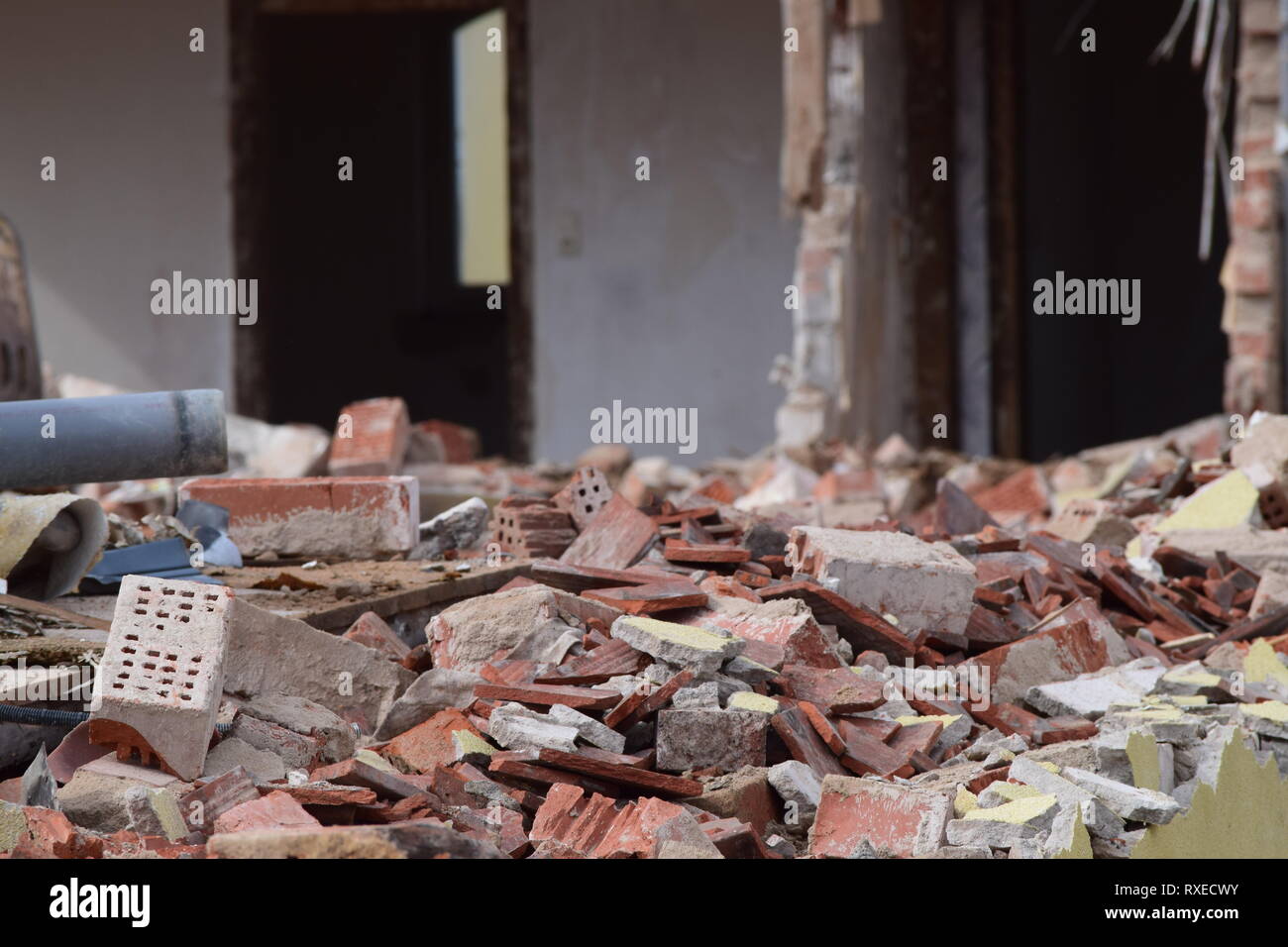 Building-rubbish in front of a Demolition house Stock Photo - Alamy