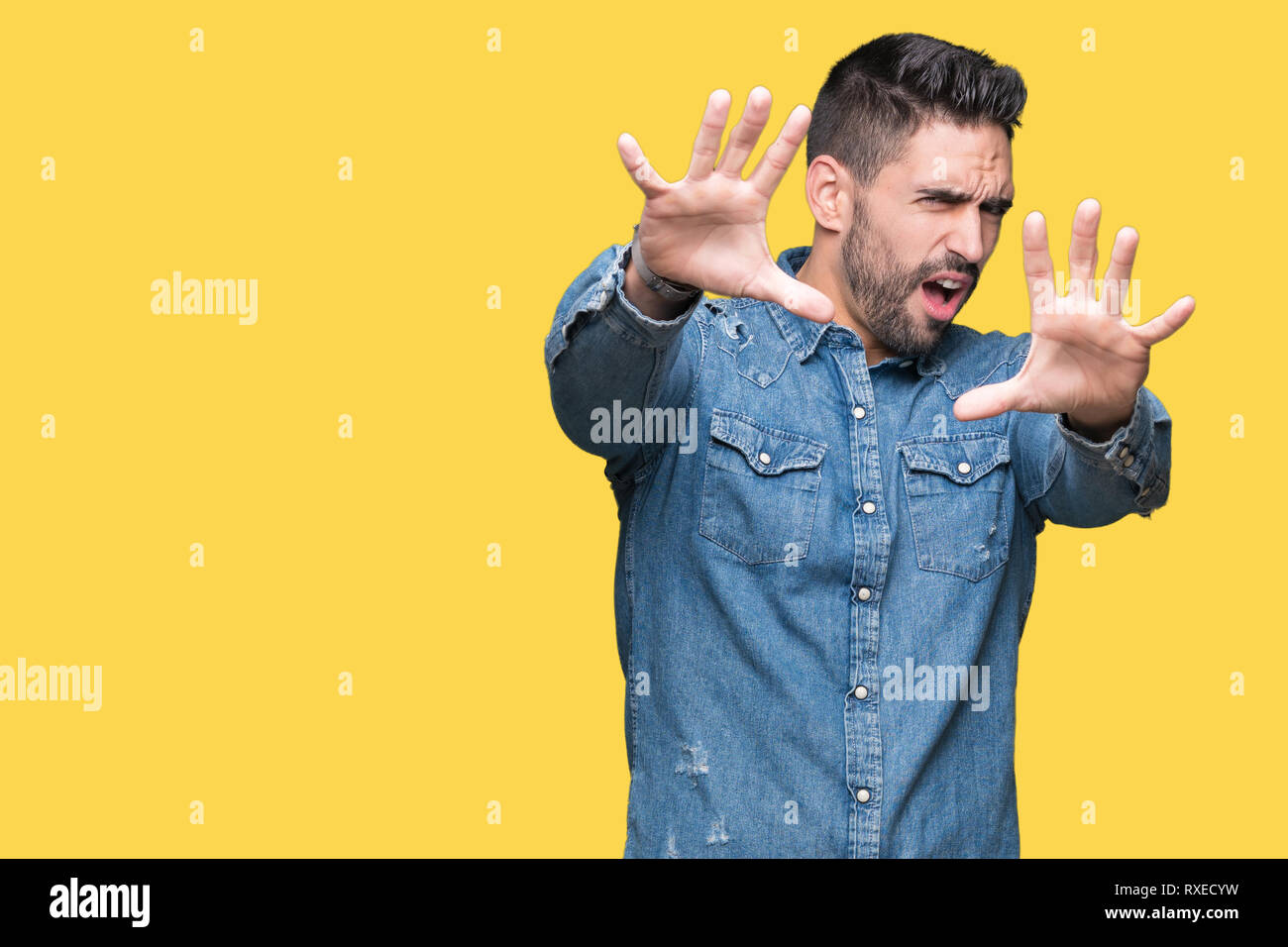 Young handsome man over isolated background afraid and terrified with ...