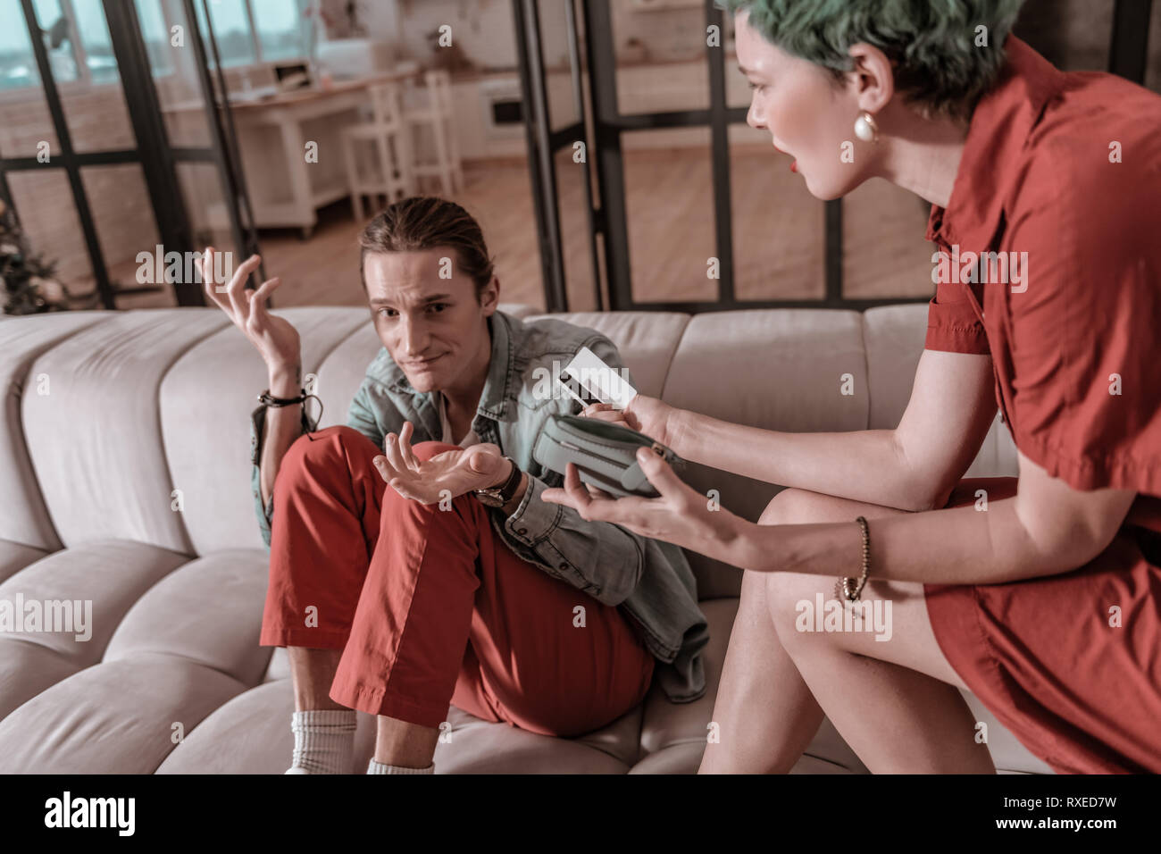 Husband spending too much money from family budget Stock Photo - Alamy