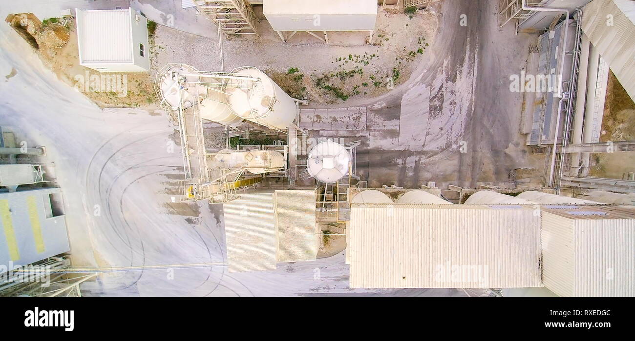 Aerial rotating view of the limestone factory. Seen are big and tall ...