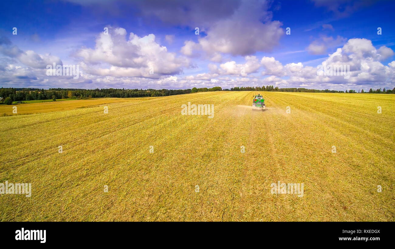 Landscape view of the field where there is a truck carrying load of ...