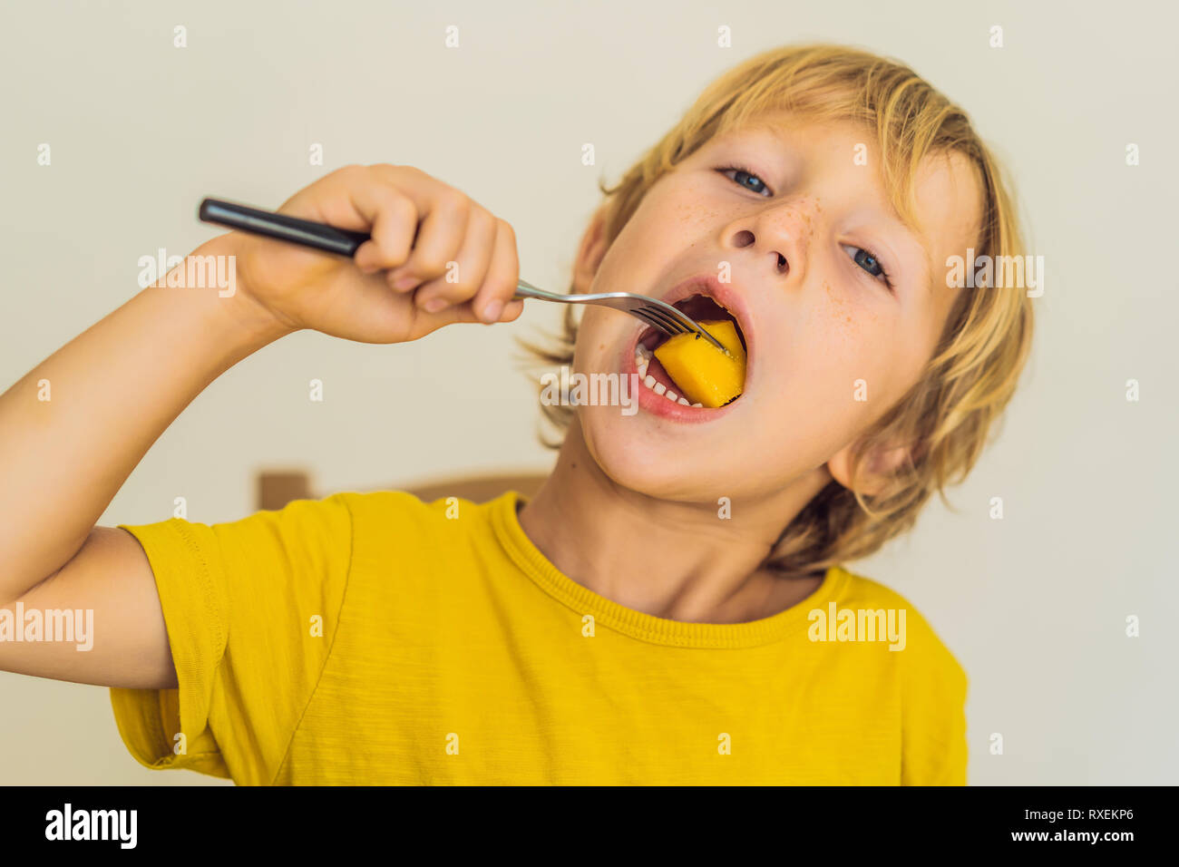 Boy eats fruit. Healthy food for children. Child eating healthy snack ...