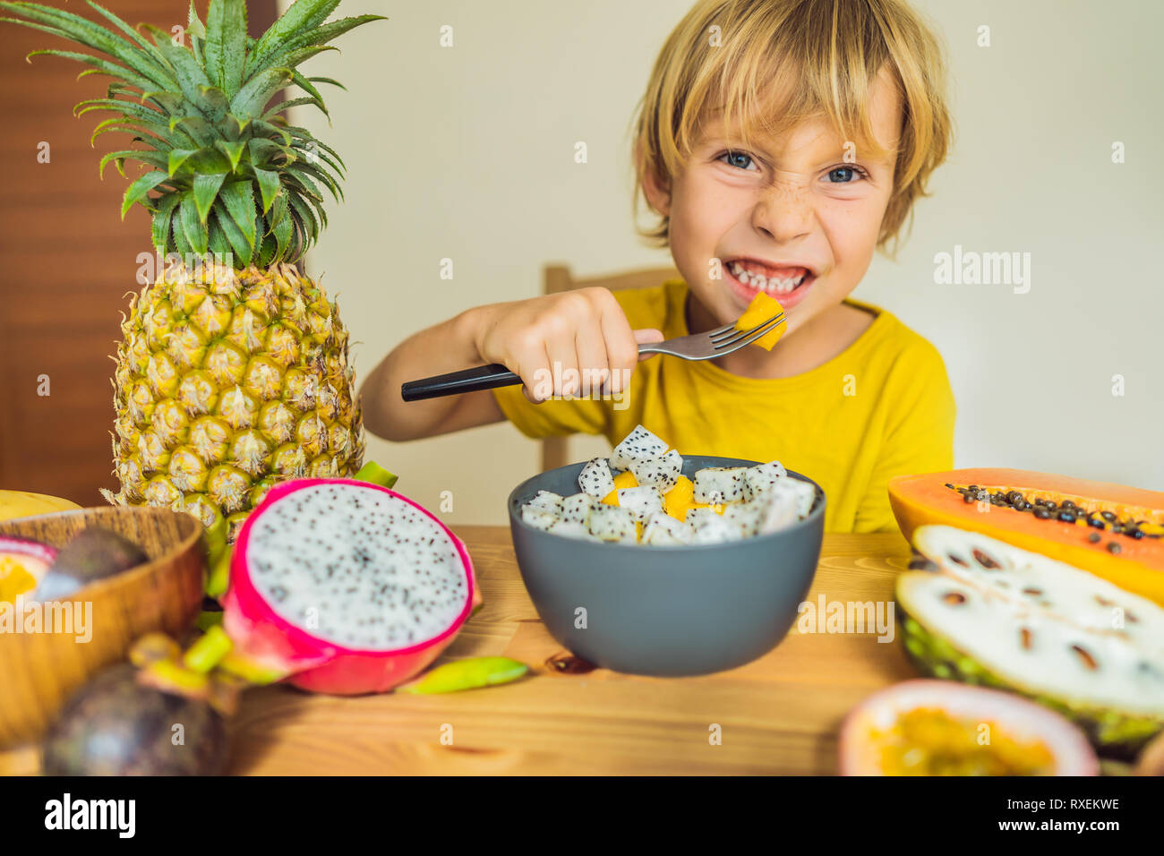 Boy eats fruit. Healthy food for children. Child eating healthy snack ...
