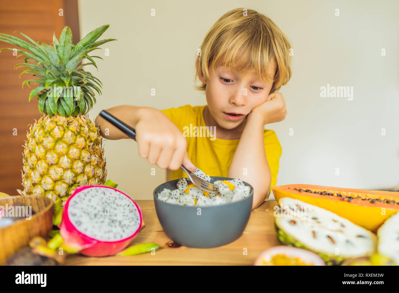 Boy eats fruit. Healthy food for children. Child eating healthy snack ...