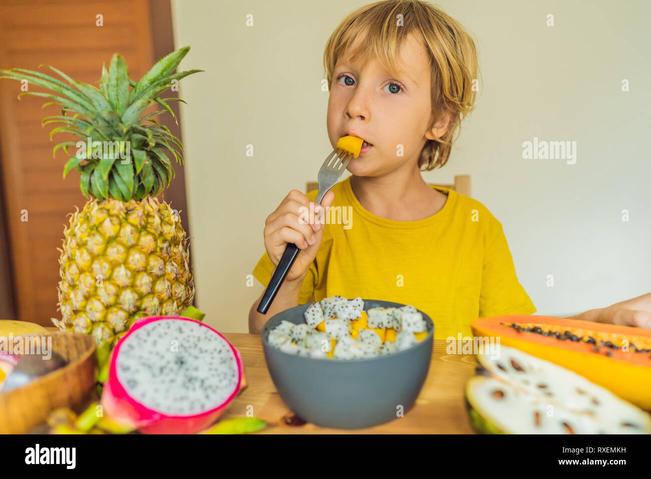 Boy eats fruit. Healthy food for children. Child eating healthy snack ...