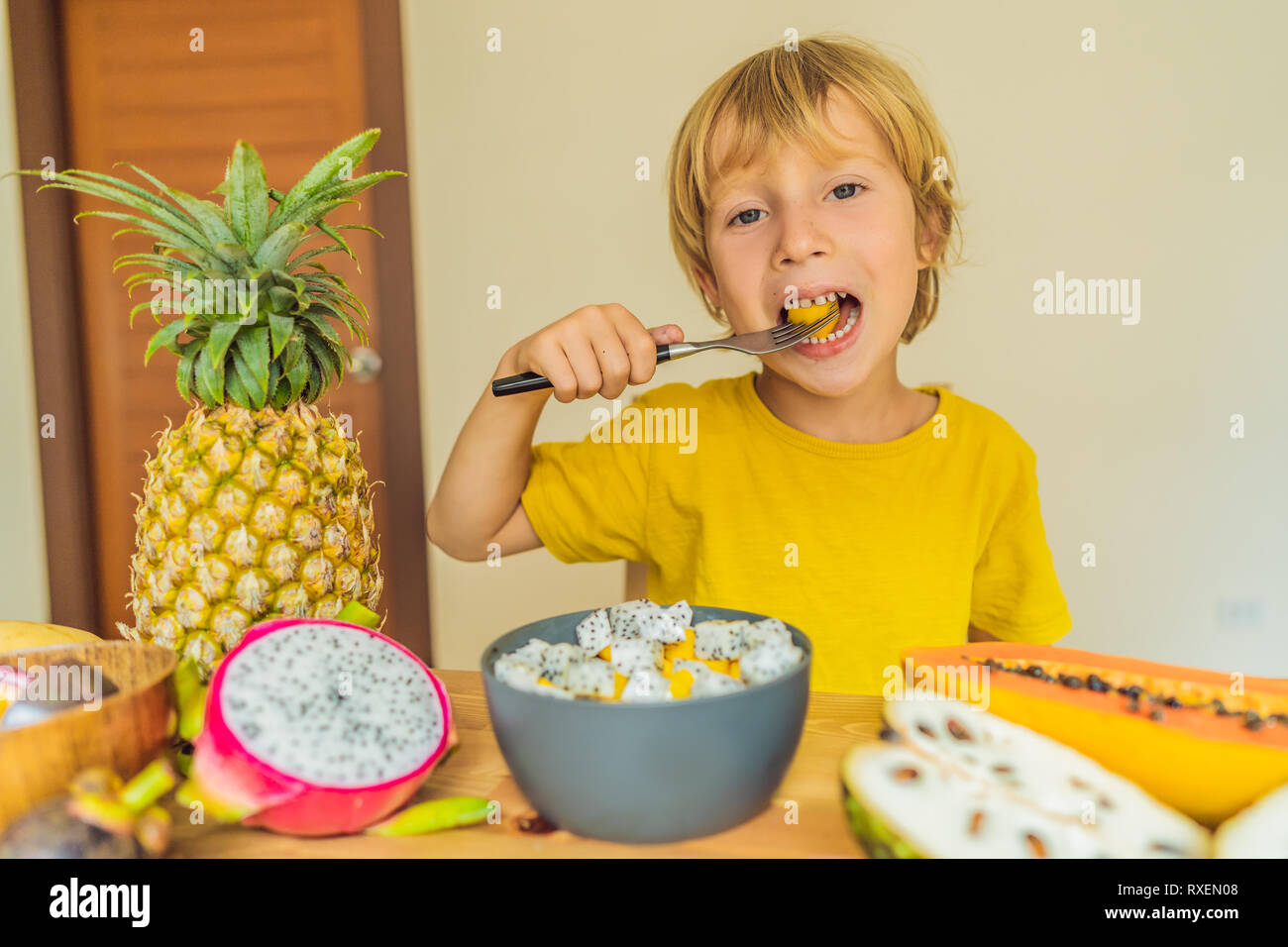 Boy eats fruit. Healthy food for children. Child eating healthy snack ...