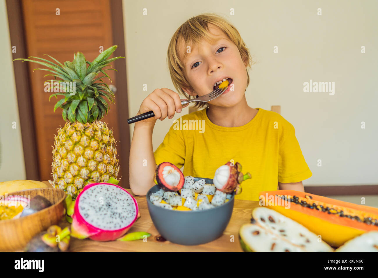 Boy eats fruit. Healthy food for children. Child eating healthy snack ...