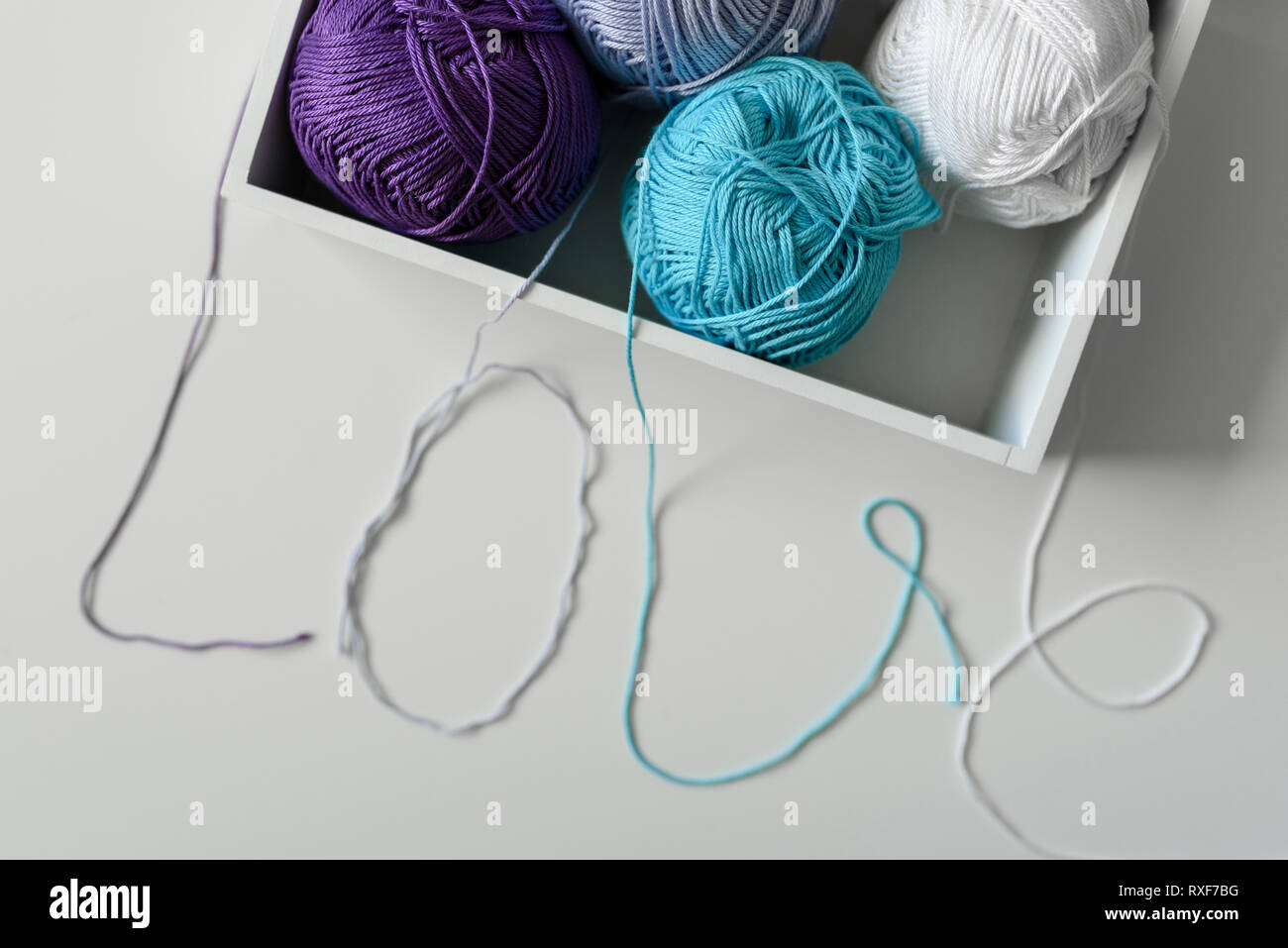 Idea for love word designed from cotton threads from yarn balls in ...