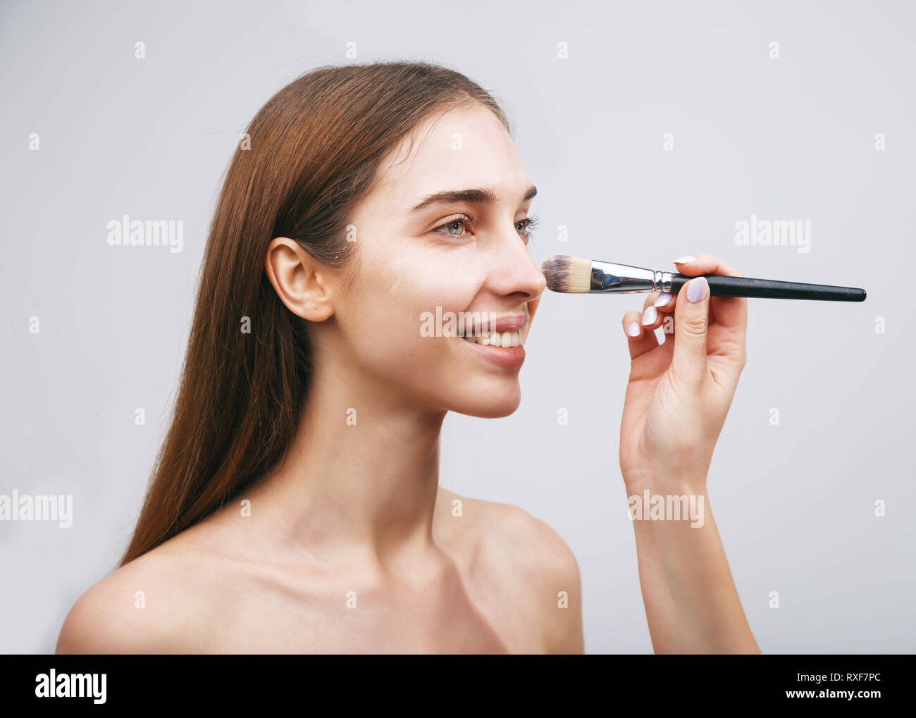 Close up woman getting make up on cheeks, visage concept Stock Photo ...