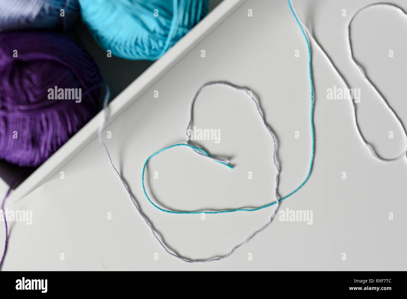 Threads from knitting yarn balls used in creative concept to design ...