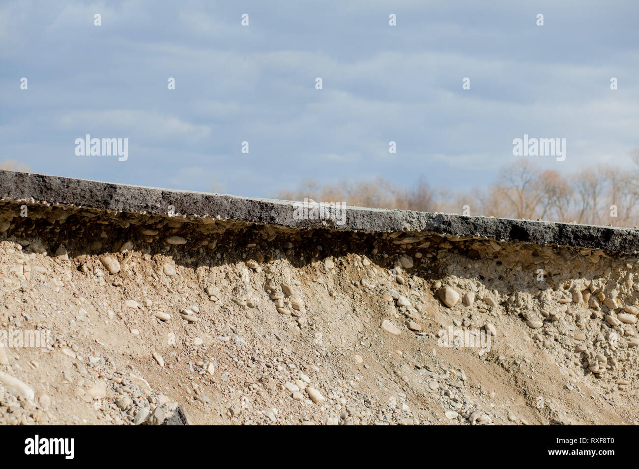 Cross section of asphalt road with blue sky background Stock Photo - Alamy
