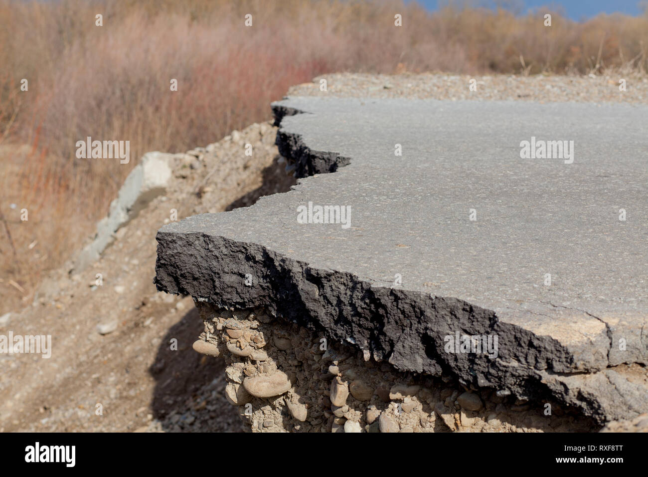 Cross section of asphalt road with blue sky background Stock Photo - Alamy