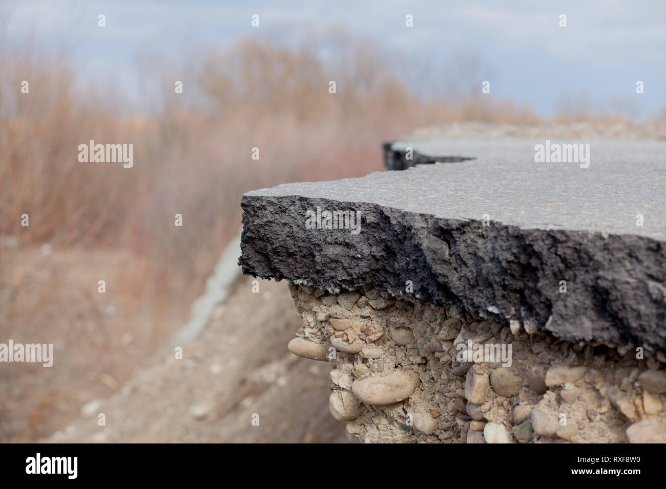 Cross section of asphalt road with blue sky background Stock Photo - Alamy
