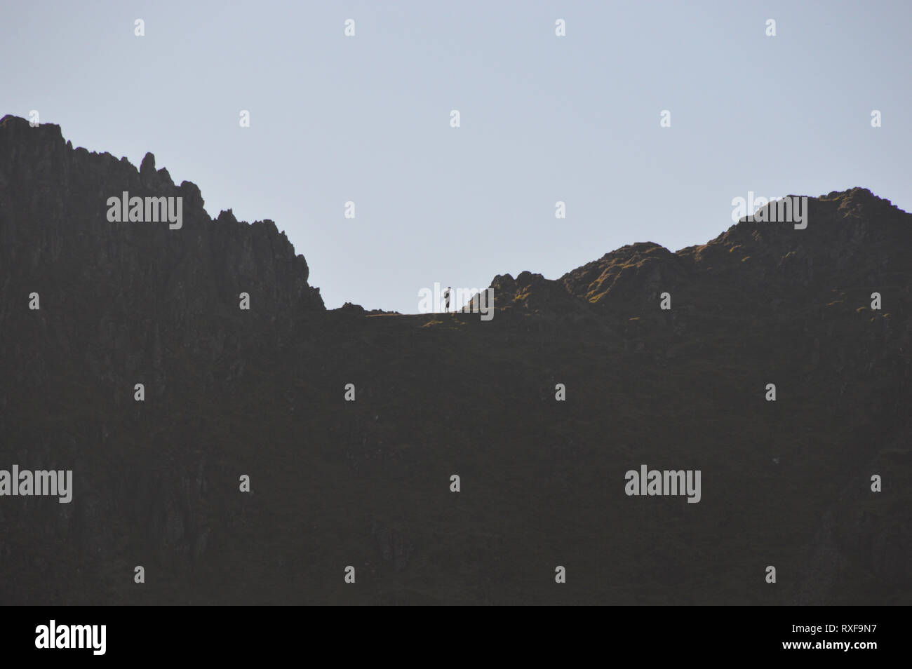 Silhouette of Lone Hiker Standing on Striding Edge on Route to the ...