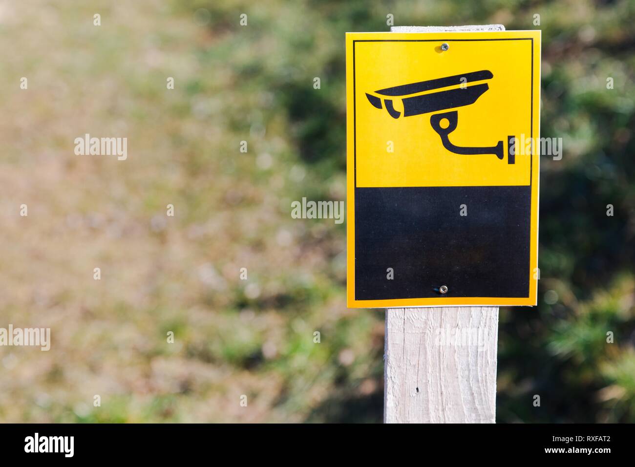 Surveillance camera sign on installed on plain board to protect ...