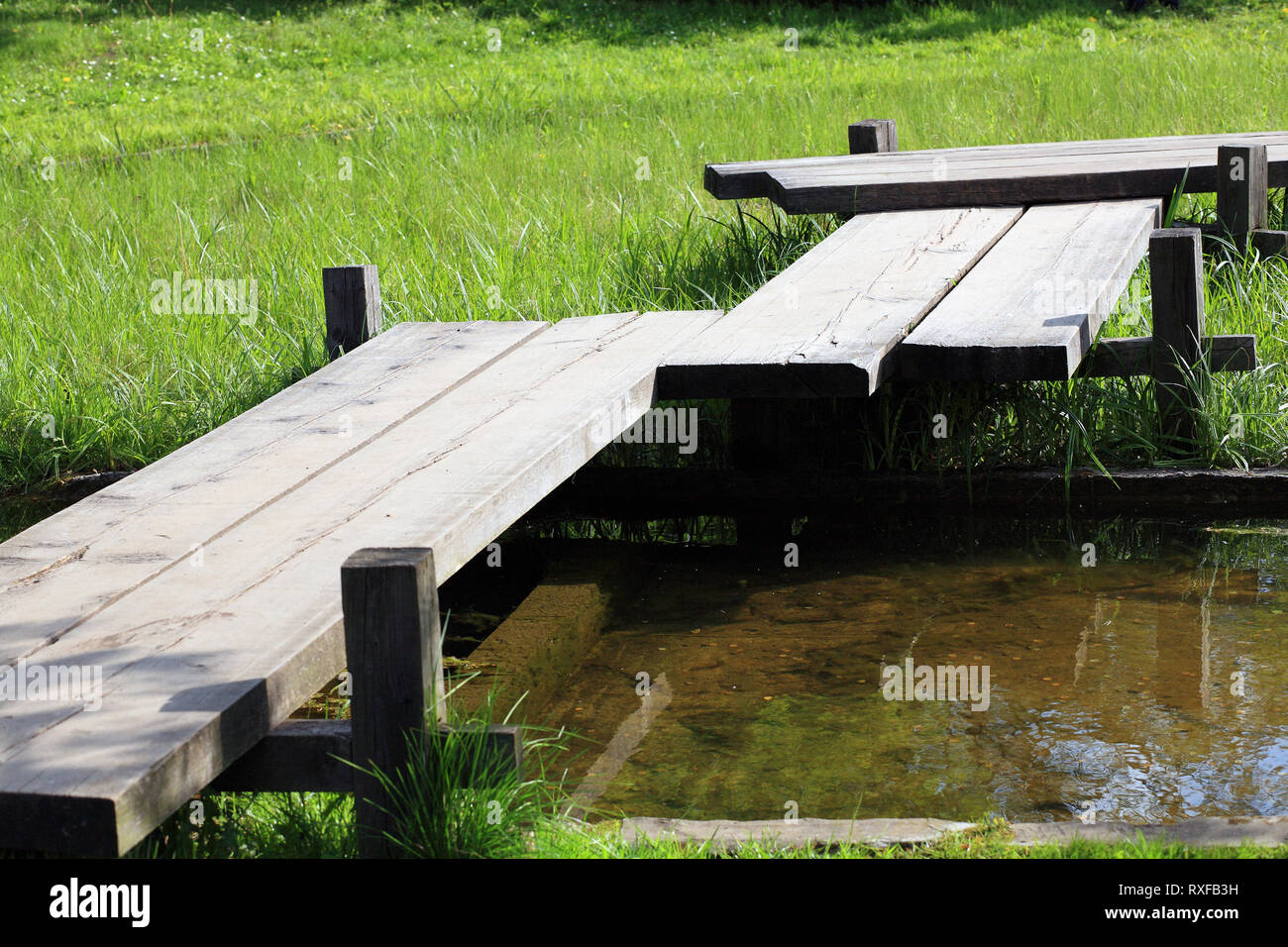 wood bridge in japan garden by Nakajima in moscow Stock Photo - Alamy