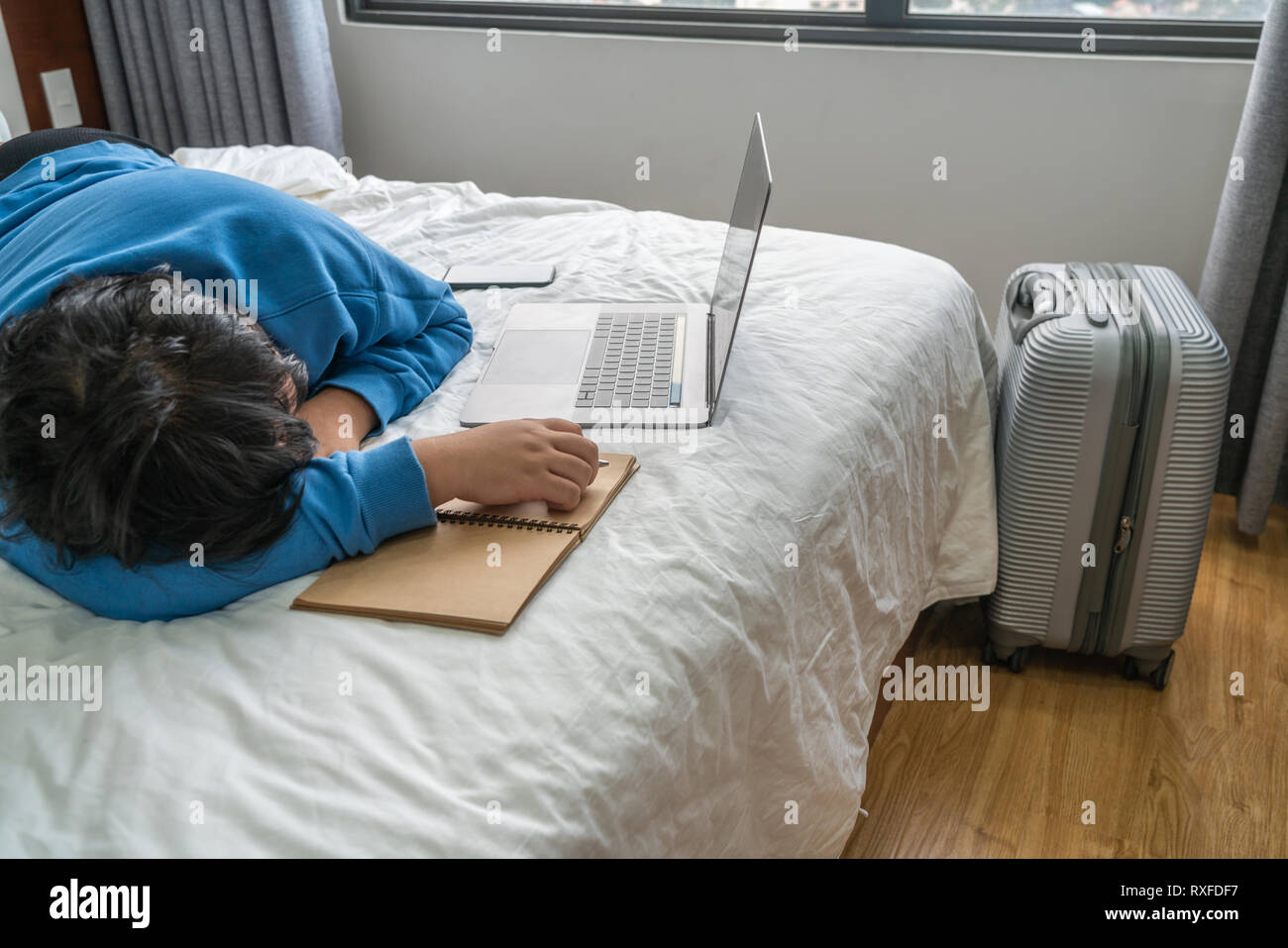 Young woman sleeping in the hotel room Stock Photo - Alamy