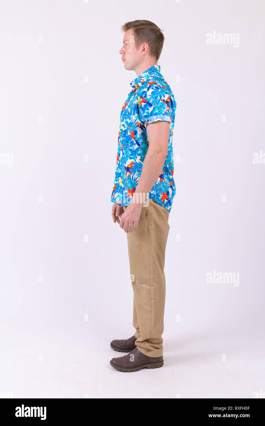 Full body shot profile view of young handsome tourist man Stock Photo ...