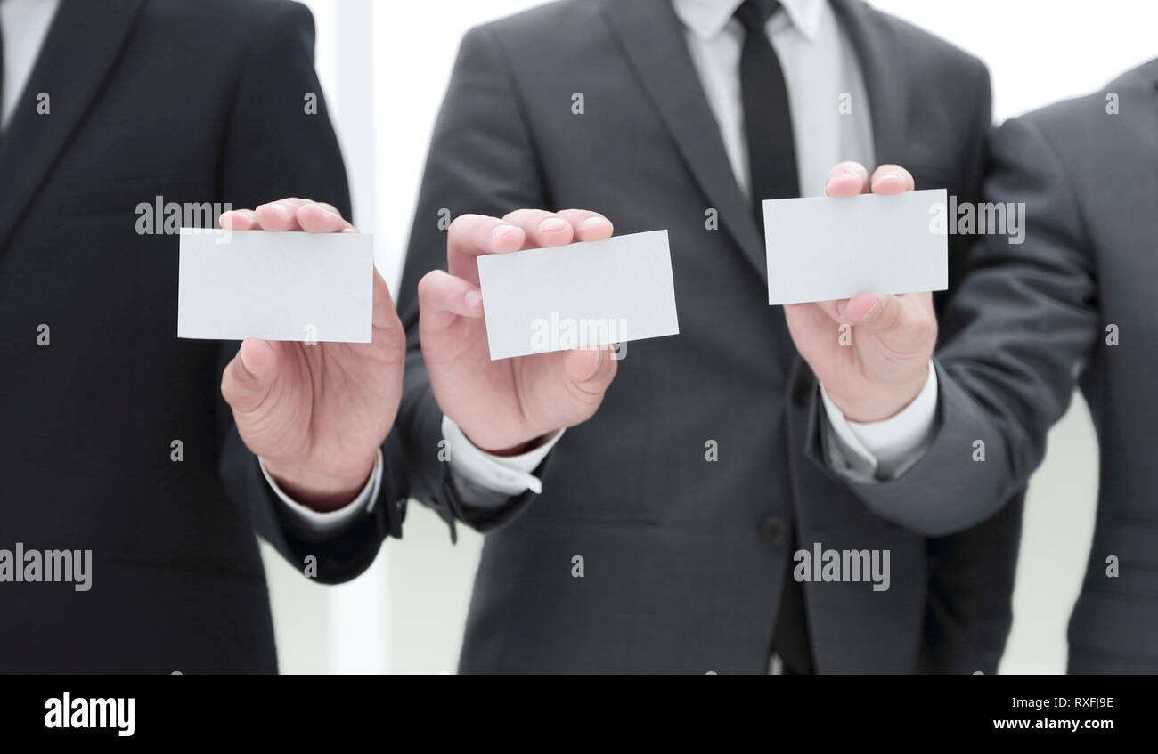 three business partners showing their business card form Stock Photo ...