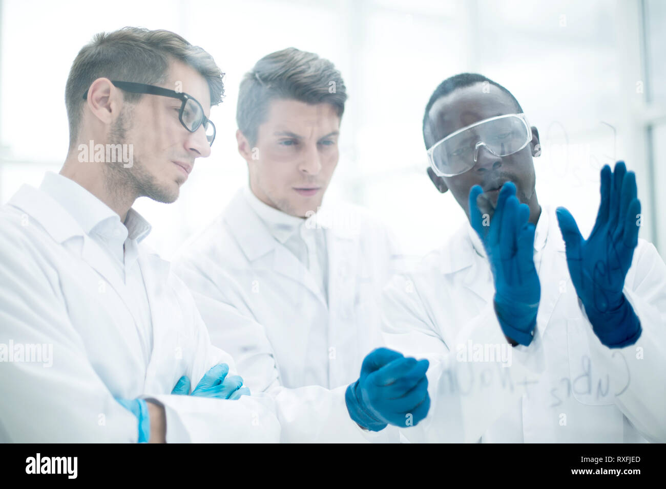 Group standing near board hi-res stock photography and images - Alamy