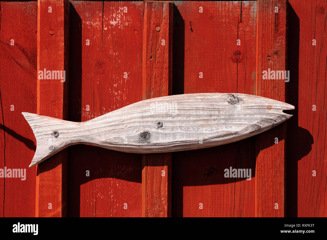 Fish of wood on shed at Hanö Harbor, Skåne, Sweden Stock Photo - Alamy