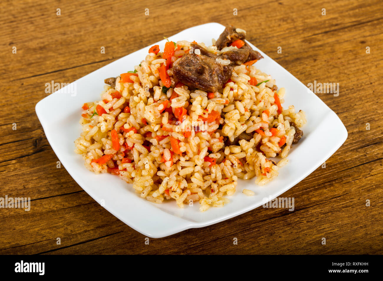 Asian rice - Plov with meat and carrot Stock Photo - Alamy
