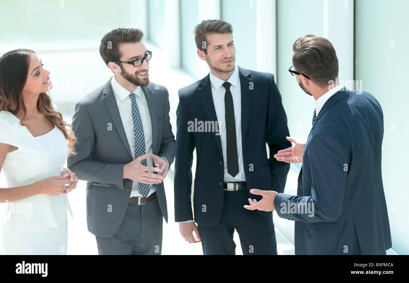 group of business people talking ,standing in the office Stock Photo ...